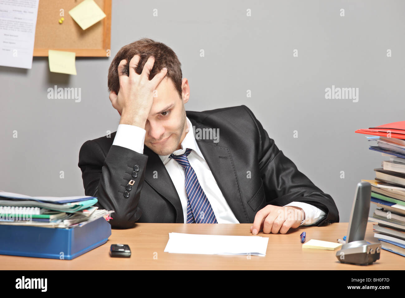 Sad businessman in the office Stock Photo - Alamy