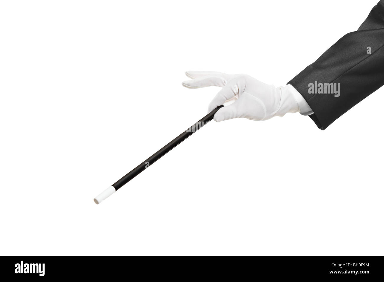 Hand holding a magic wand, isolated on white background Stock Photo - Alamy