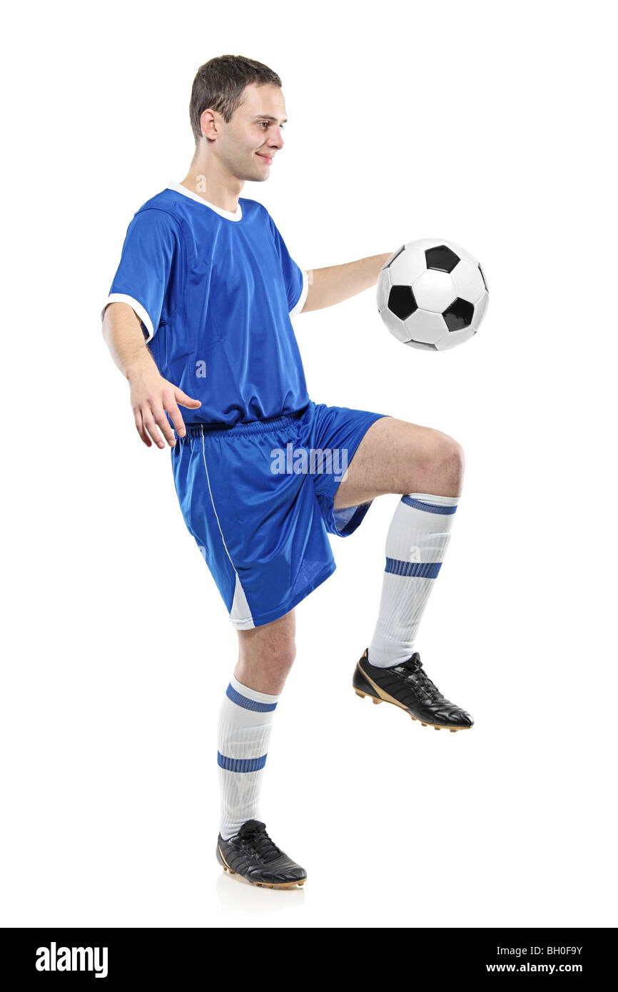 Soccer player with a ball isolated on white background Stock Photo - Alamy