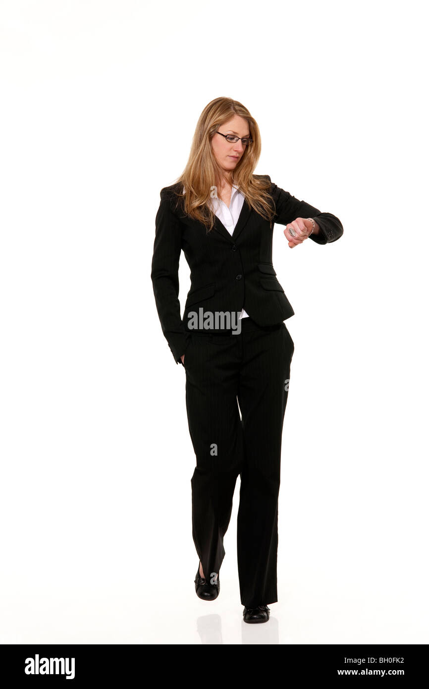 A business woman checks her watch Stock Photo - Alamy