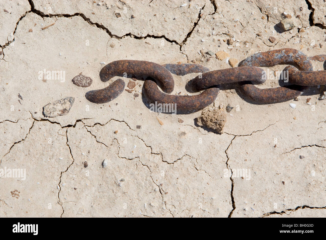 A rusty chain in the mud at the Salton Sea in California Stock Photo ...