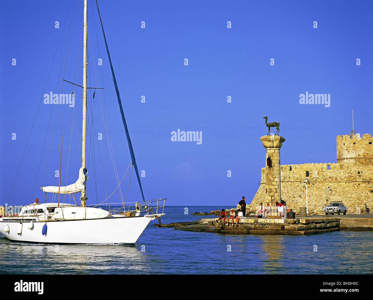 Deer statue in Mandraki harbor Rhodes Greece Stock Photo - Alamy