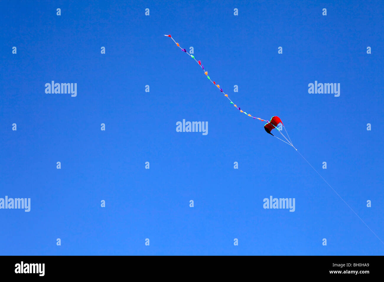 colour kite in blue sky Stock Photo - Alamy
