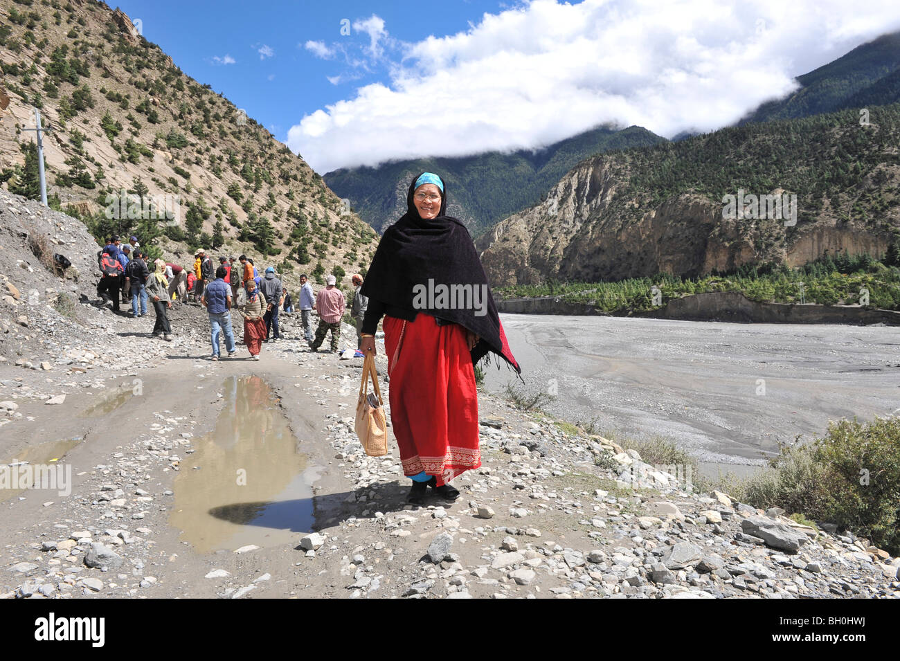Asia, Nepal, group of local people in mountain landscape Stock Photo ...