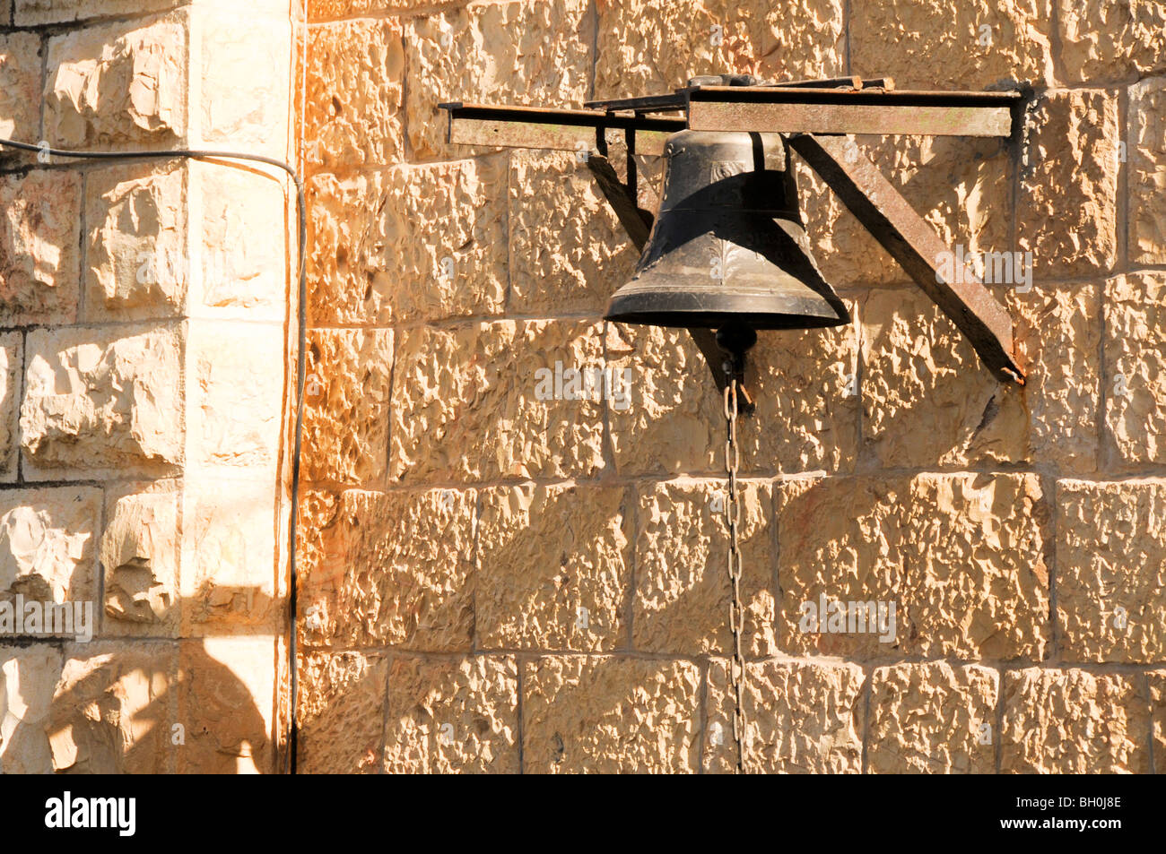 Israel, Jerusalem, Bell hangs on outer wall of the Dormition Abbey ...