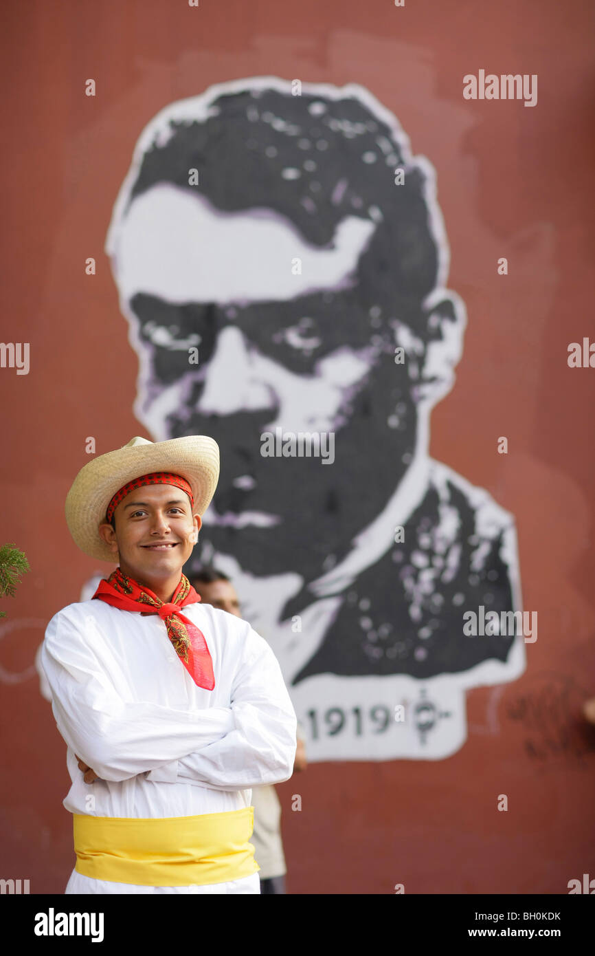 Man in traditional clothes in front of a mural, Oaxaca, Mexico Stock ...