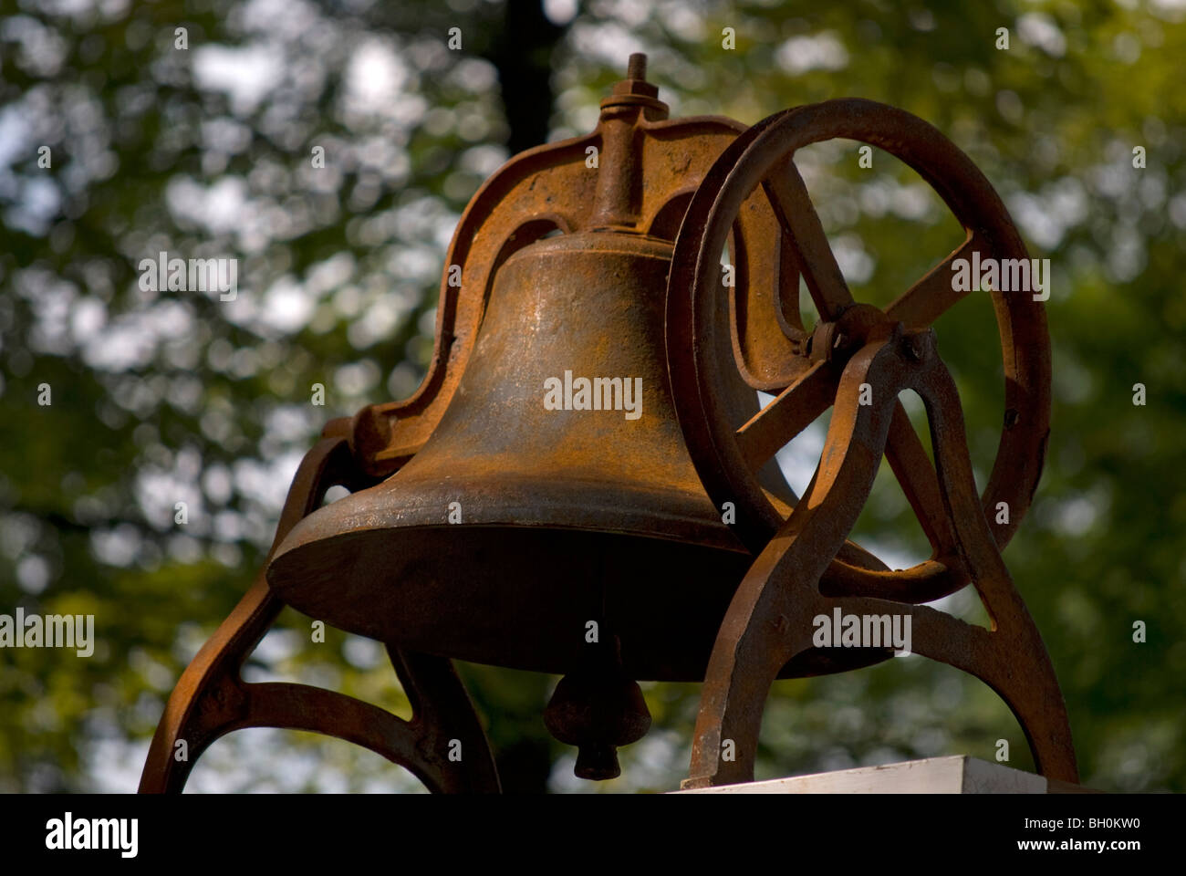 Rusting Victorian-Era church bell located behind the Hutchinson House ...