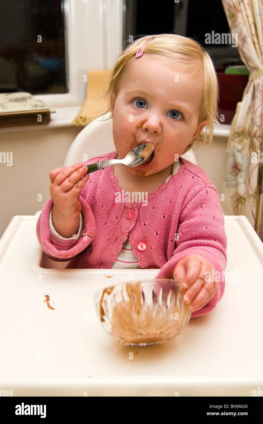 Baby girl covered in food hi-res stock photography and images - Alamy