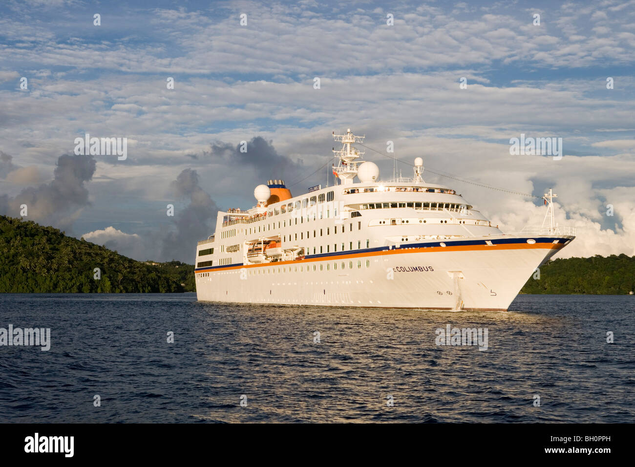 Cruiseship MV Columbus raising anchor in the light of the evening sun ...