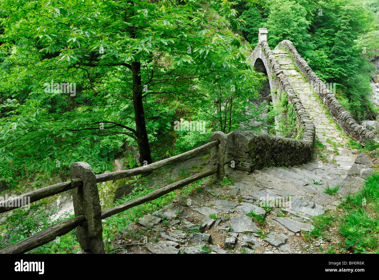 Stone arch bridge Ponte Romano over river Melezza, Intragna, Centovalli ...