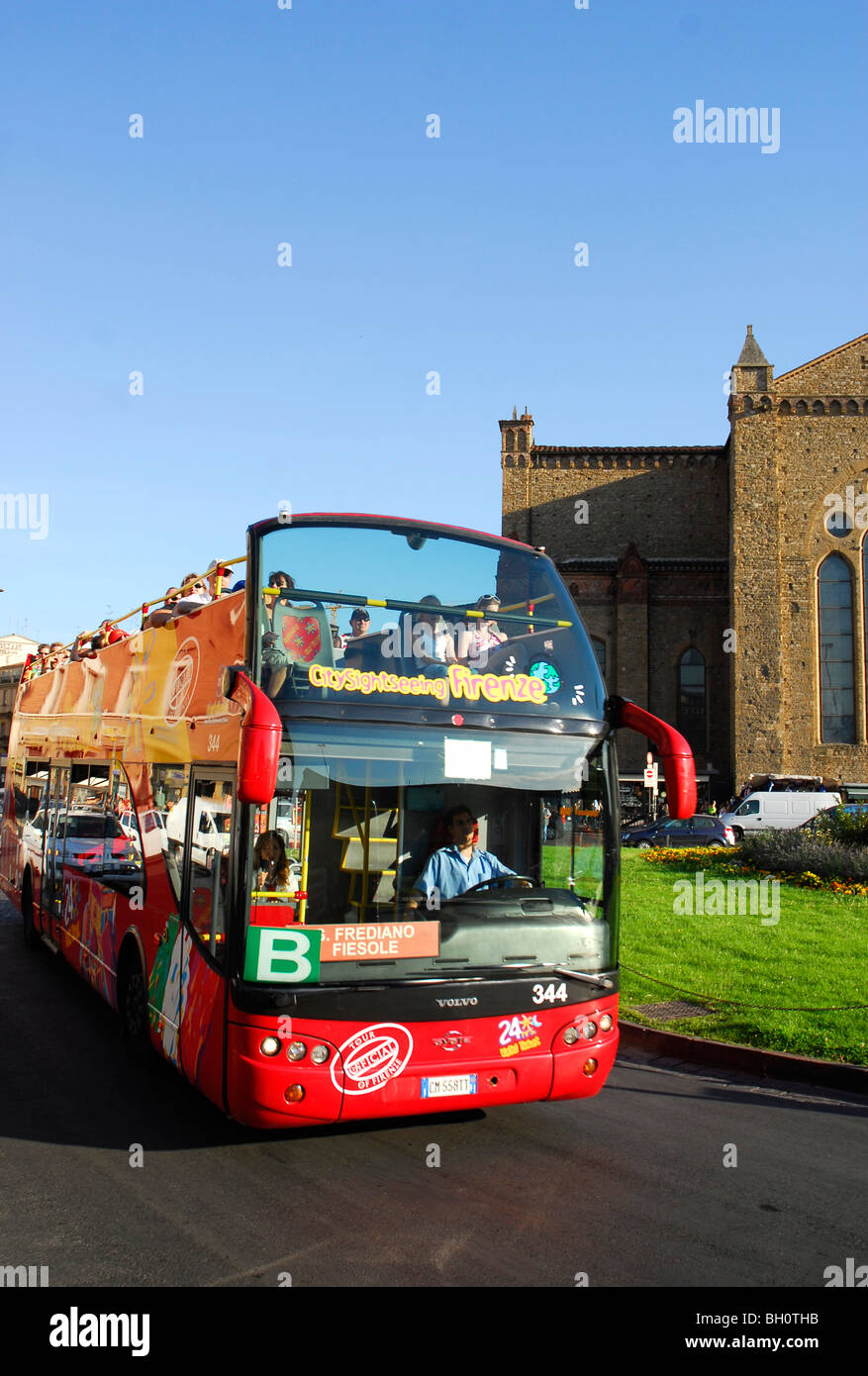 City Sightseeing, double decker bus with tourists under blue sky ...