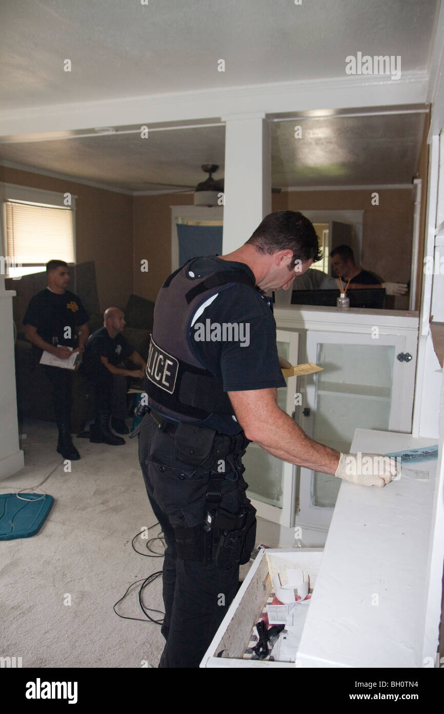 Police officers from Street Narcotics Unit tactical squad searching for ...