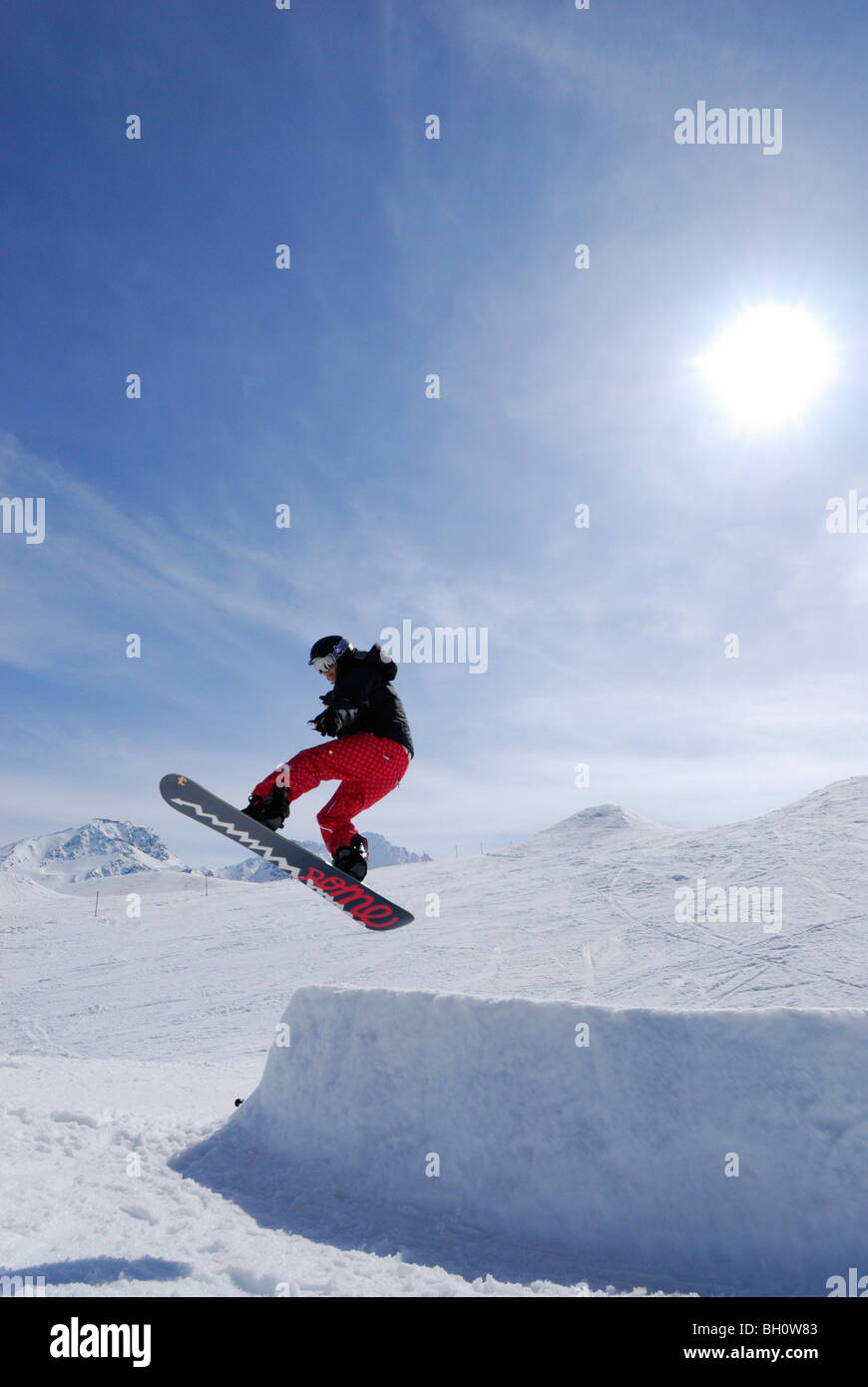 Snowboarder jumping from a kicker, ski area Soelden, Oetztal, Tyrol ...