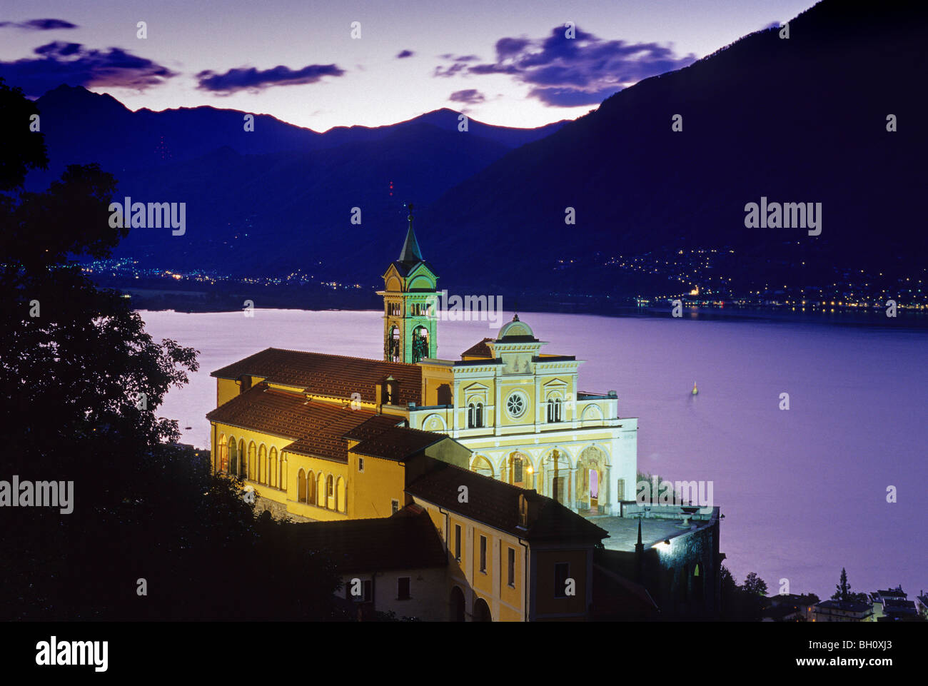 The illuminated church Madonna del Sasso in the evening, Locarno, Lago ...