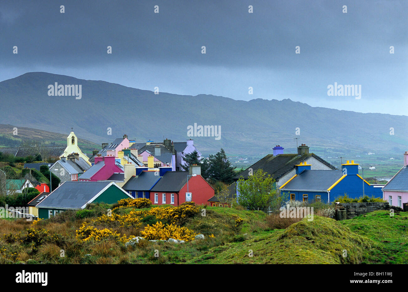 Colourful houses under grey clouds, Eyeries, Beara peninsula, County ...