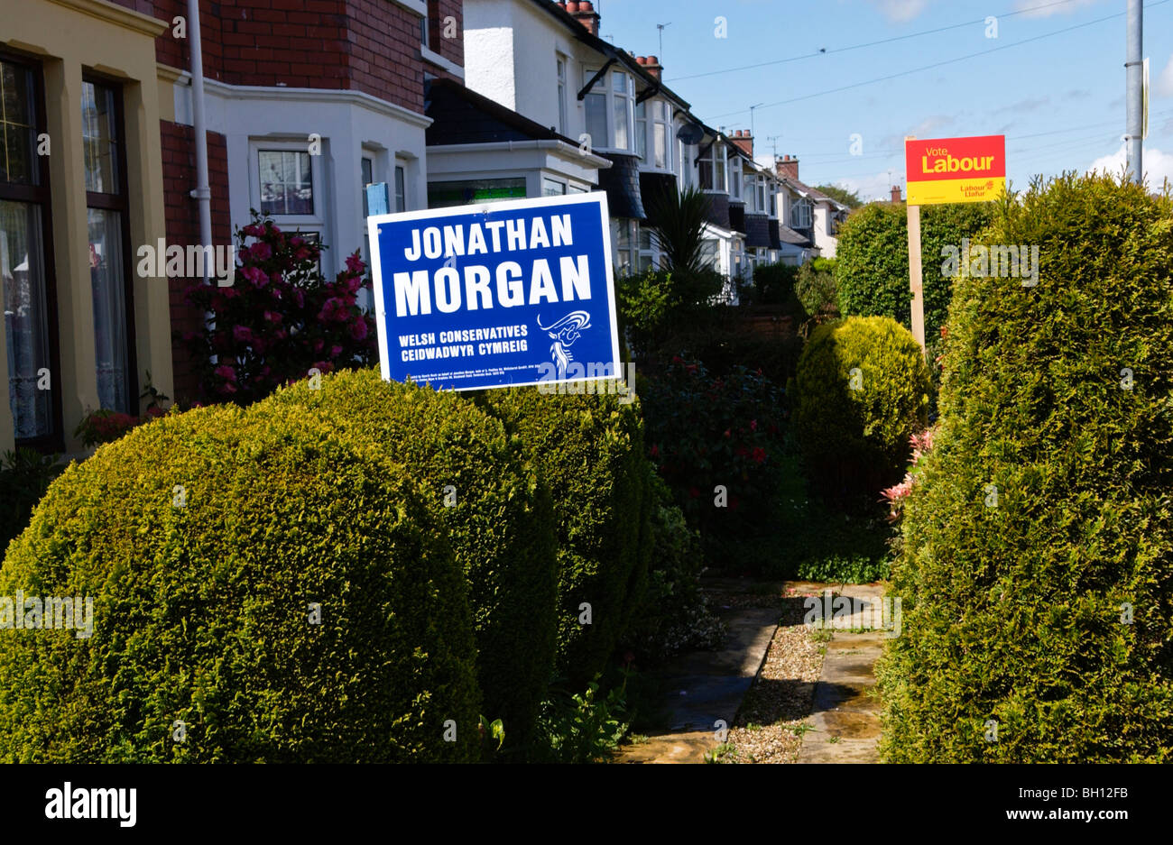 Conservative and Labour Party posters on front gardens of houses in the ...