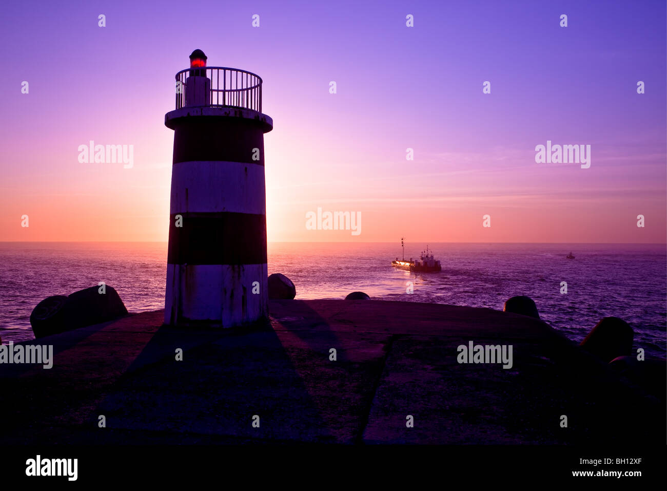 Beautiful landscape picture of a lighthouse at sunset Stock Photo - Alamy