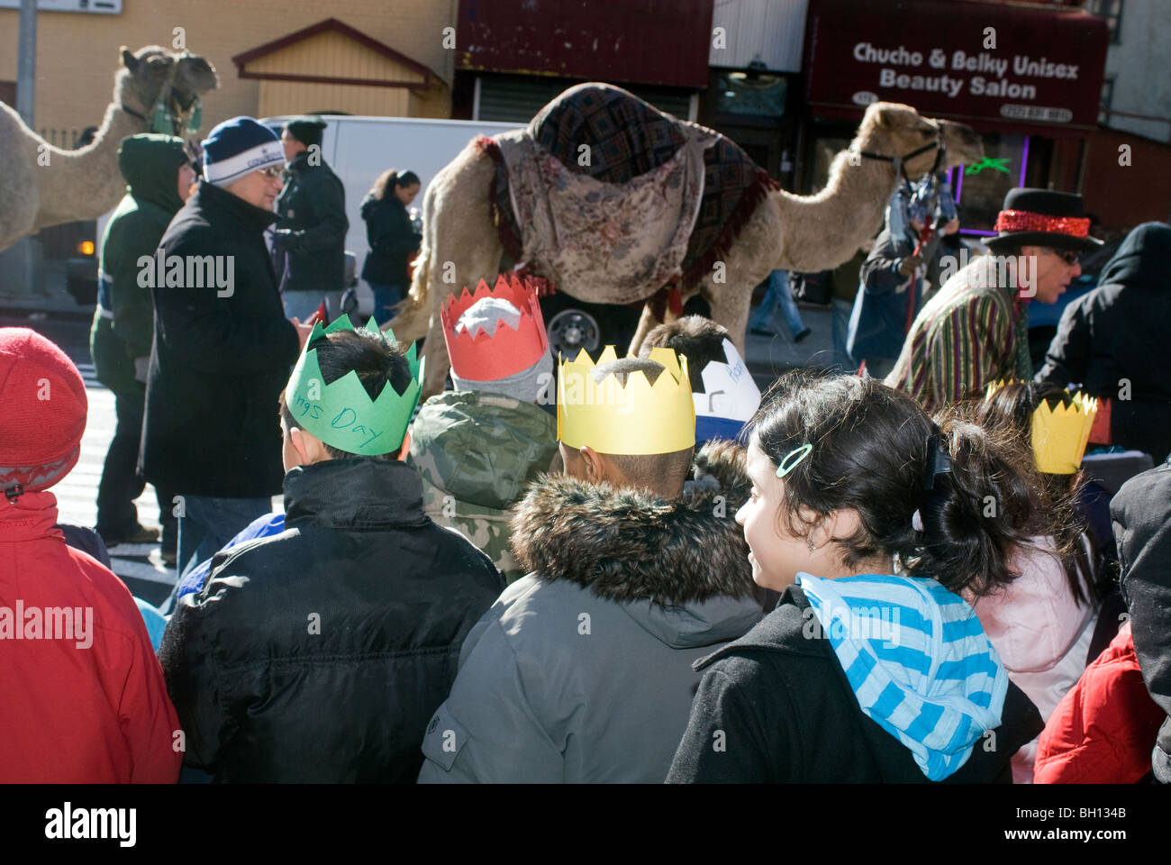 Children watch the camels in the 33rd Annual Three Kings Day Parade in ...