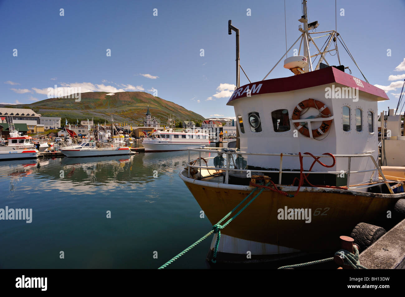 Boats in harbour at the northern port of Husavik, Iceland Stock Photo ...
