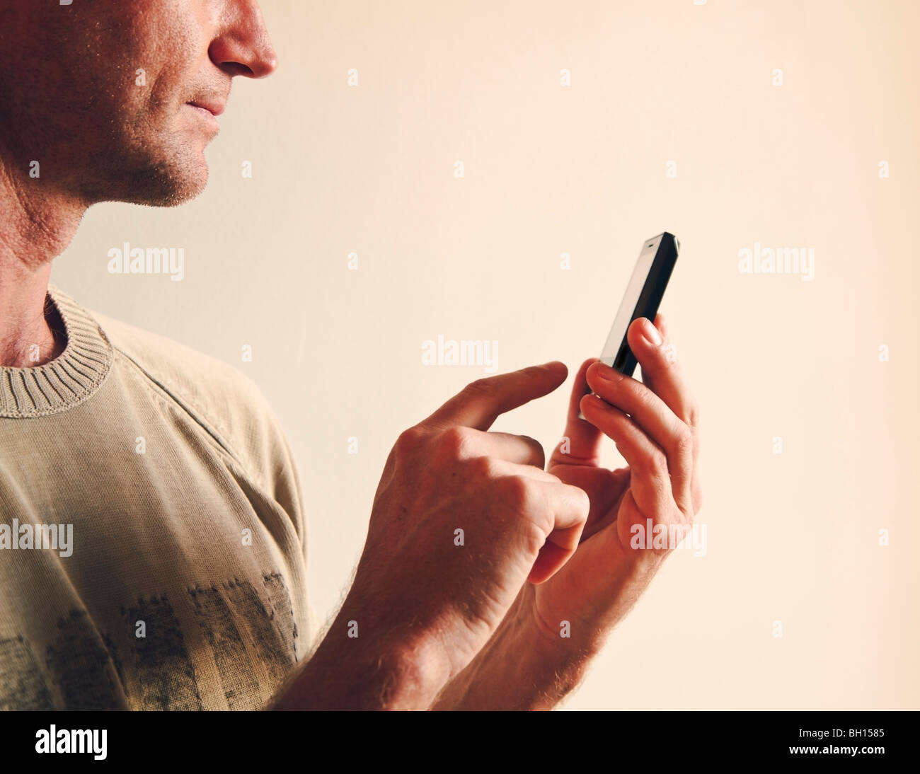 Middle-aged man using cell phone Stock Photo - Alamy