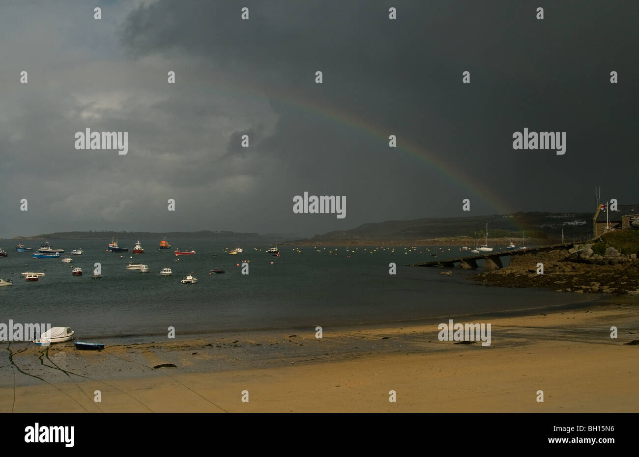 Town Beach, Isles of Scilly, storm coming with rainbow Stock Photo - Alamy