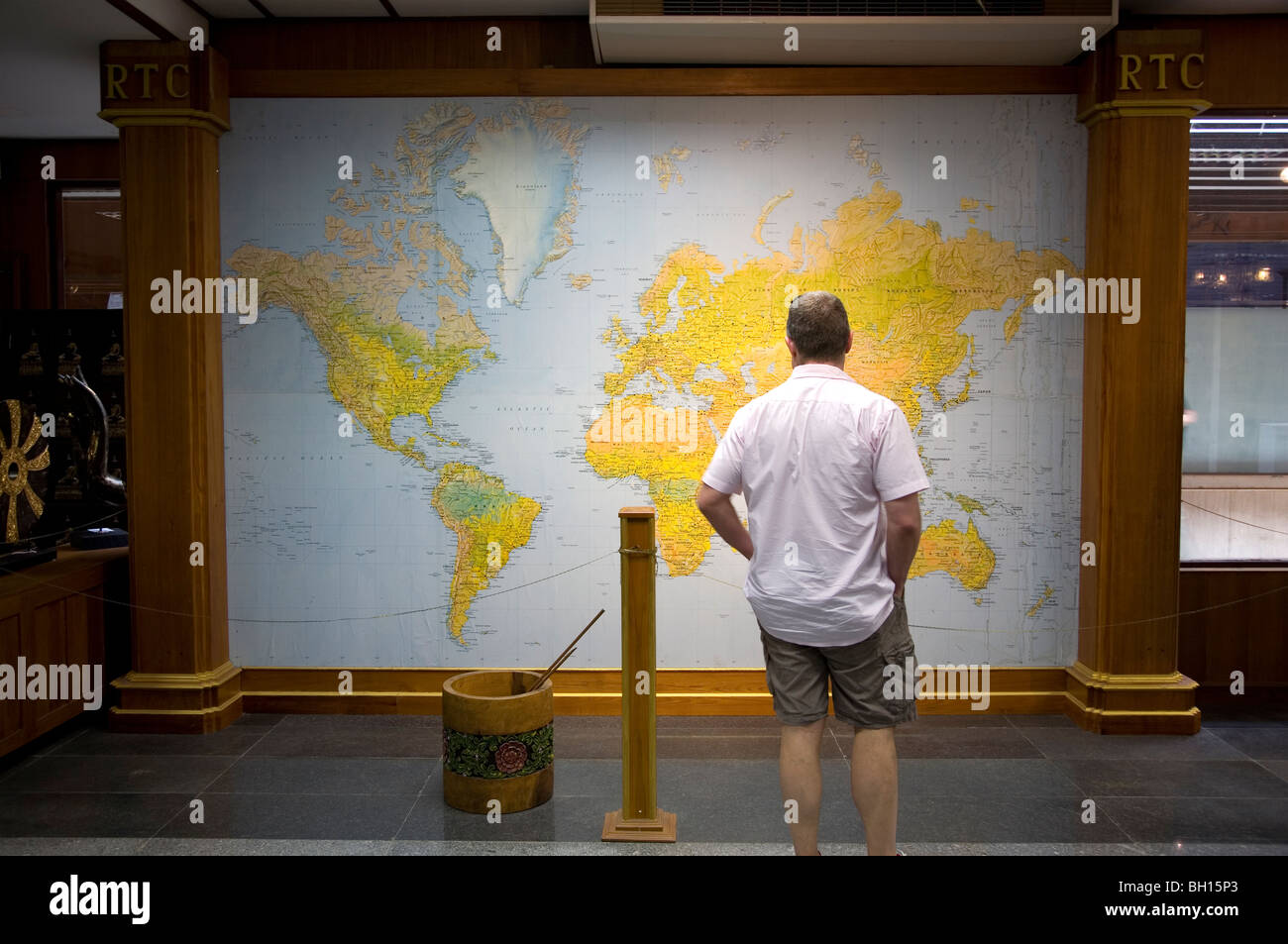 Man standing in front of World Map Stock Photo - Alamy