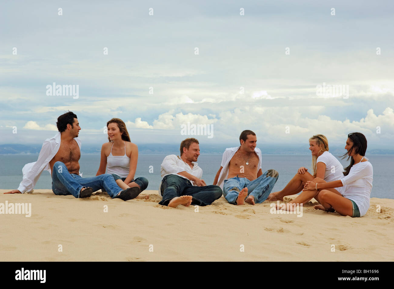 Group of friends on beach Stock Photo - Alamy