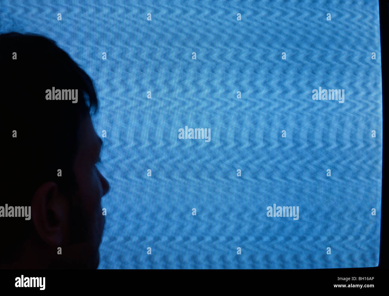 man watching tv screen Stock Photo - Alamy