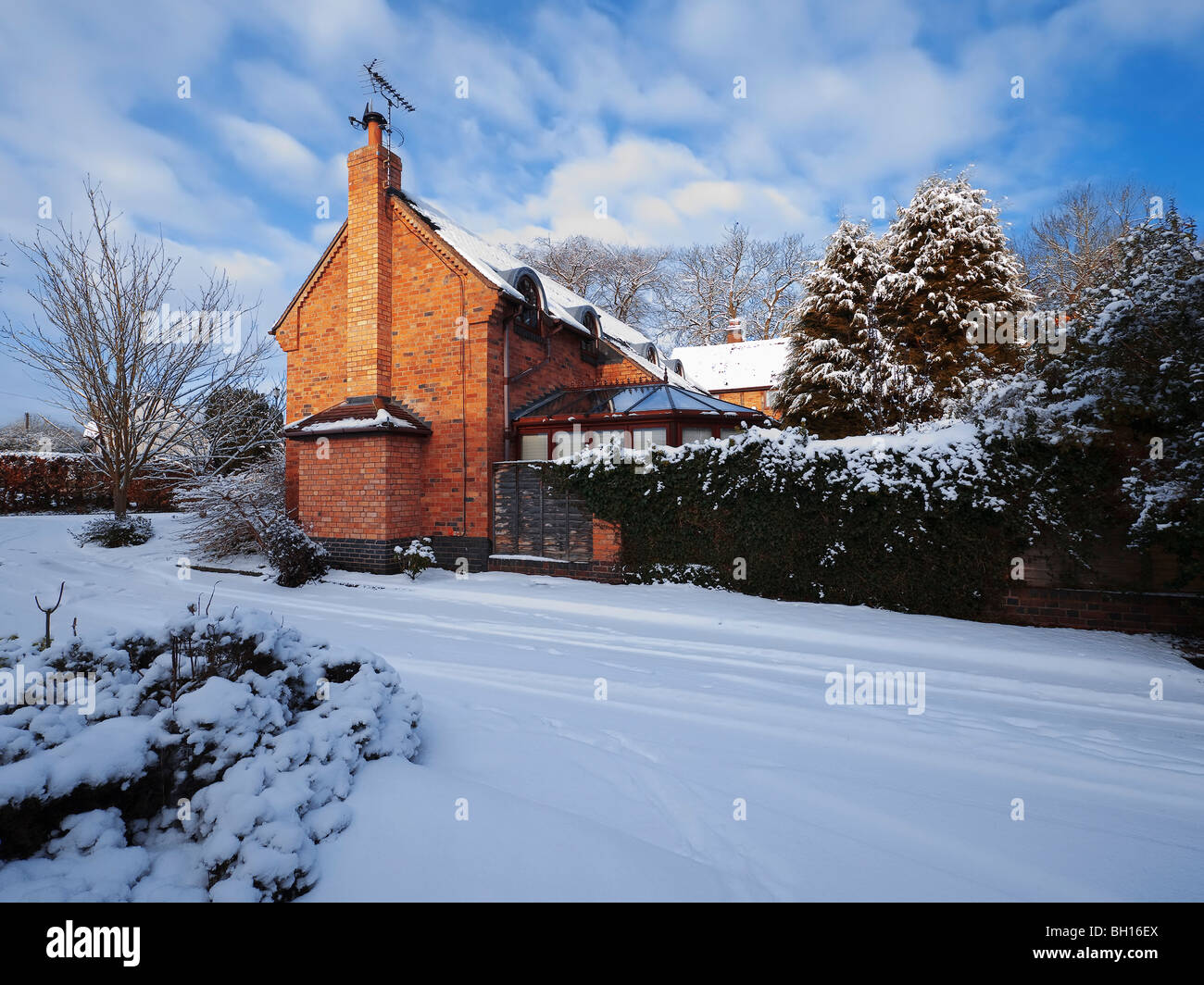 A snow covered rural landscape in a village Stock Photo - Alamy