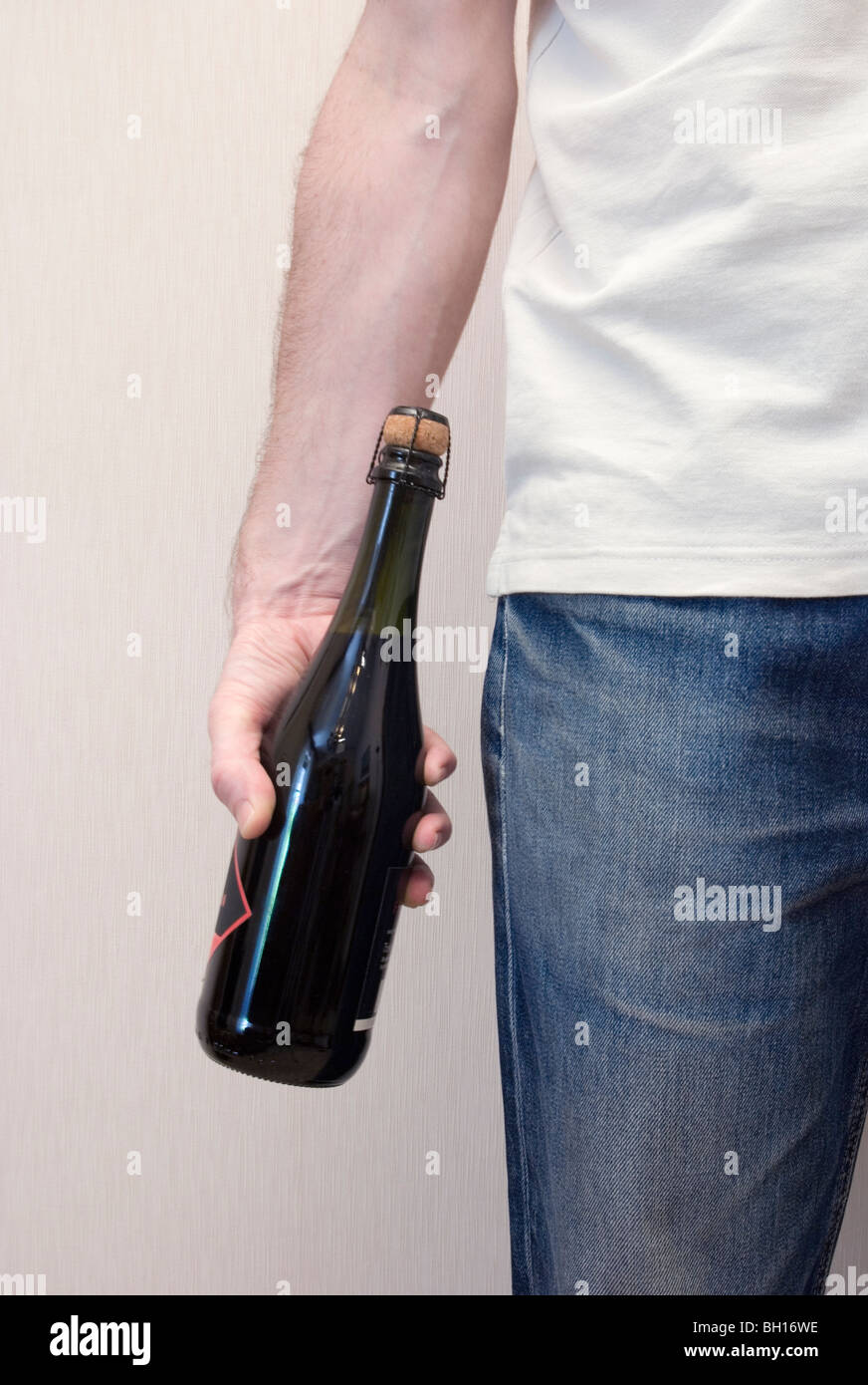 man holding wine bottle Stock Photo - Alamy