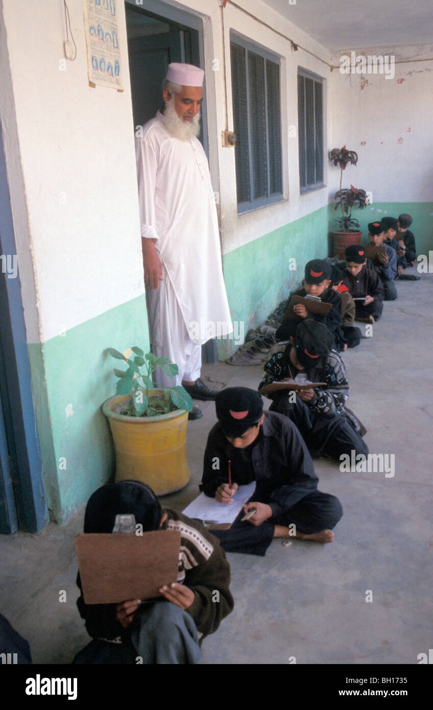 PAKISTAN.TEACHER AND STUDENTS OUTSIDE CLASSROOM IN A PRIMARY STATE ...