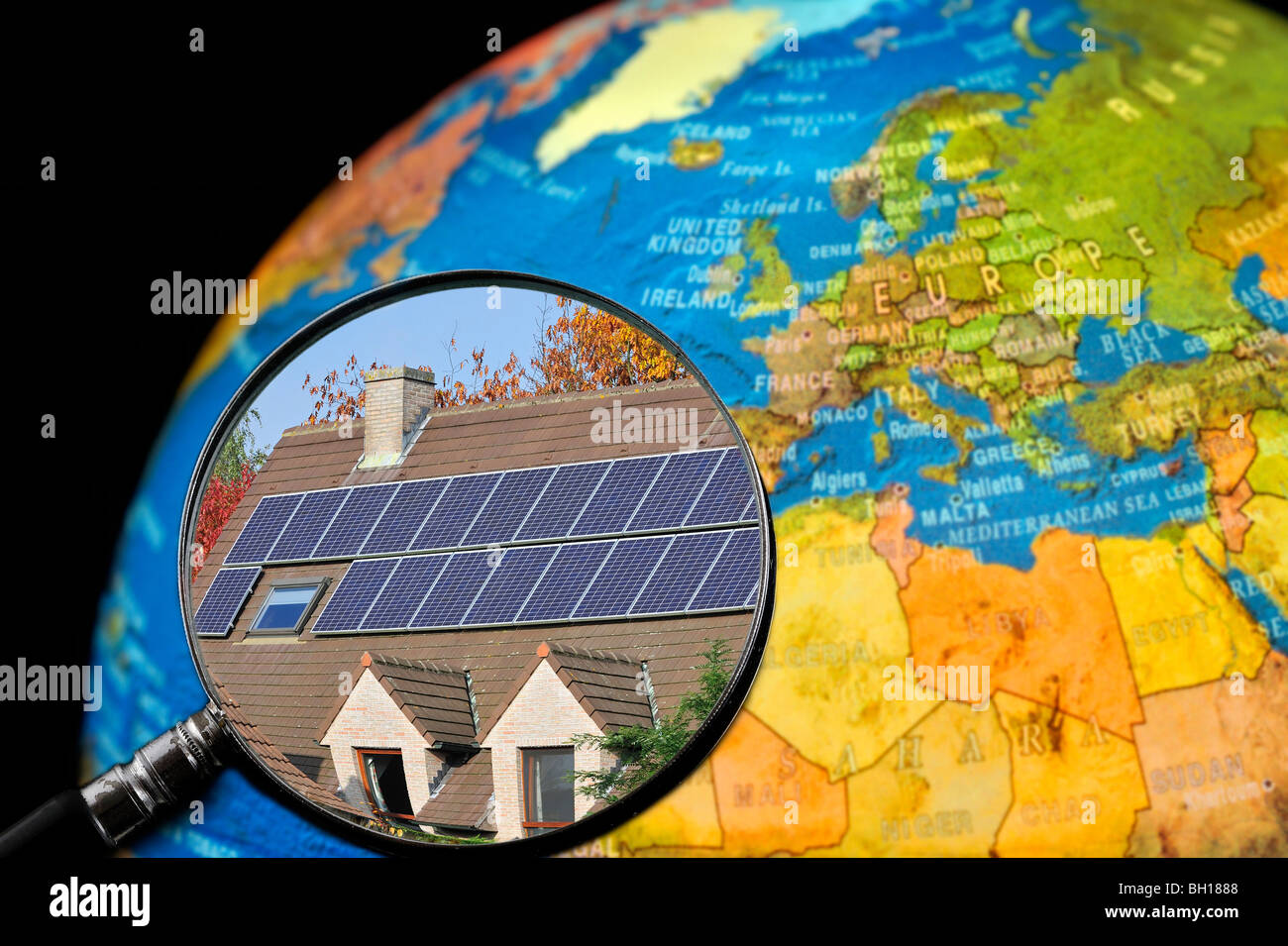 Photovoltaic solar panels / cells on roof of house seen through ...