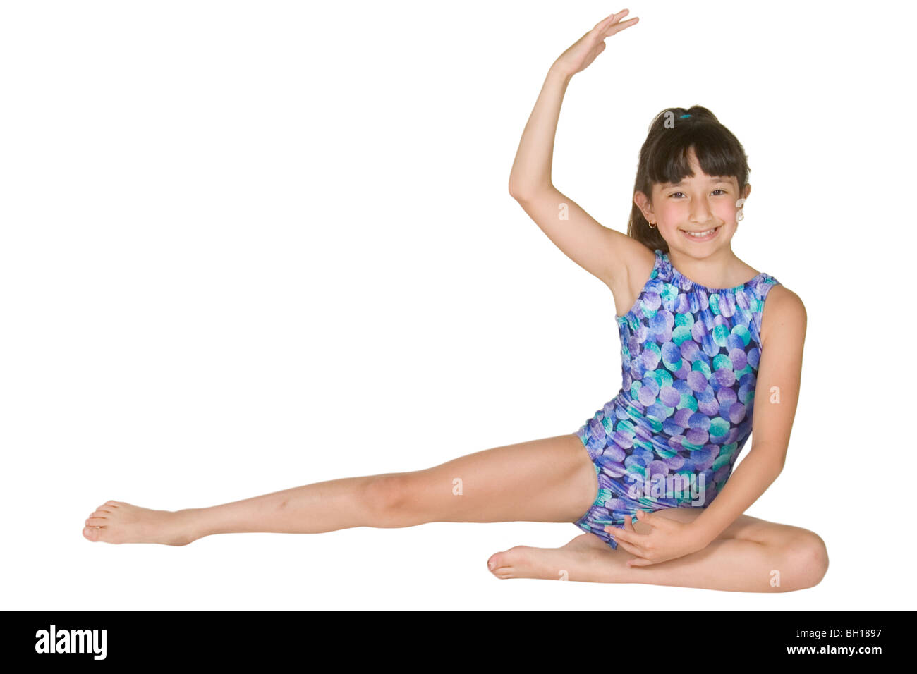 Cute Caucasian child in gymnastic poses Stock Photo - Alamy