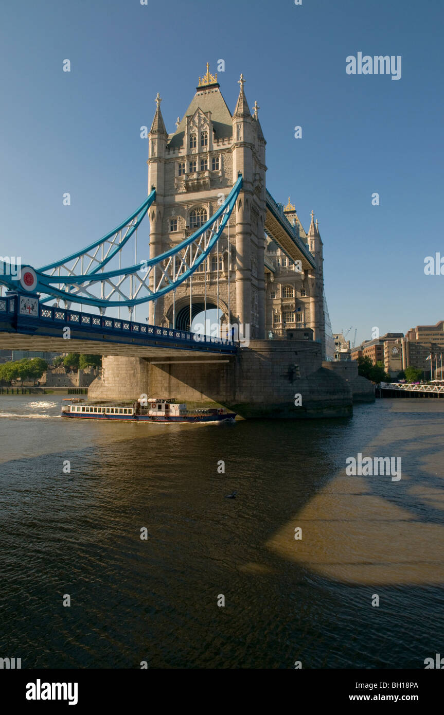 Tourist boat underneath Tower bridge in London Stock Photo - Alamy