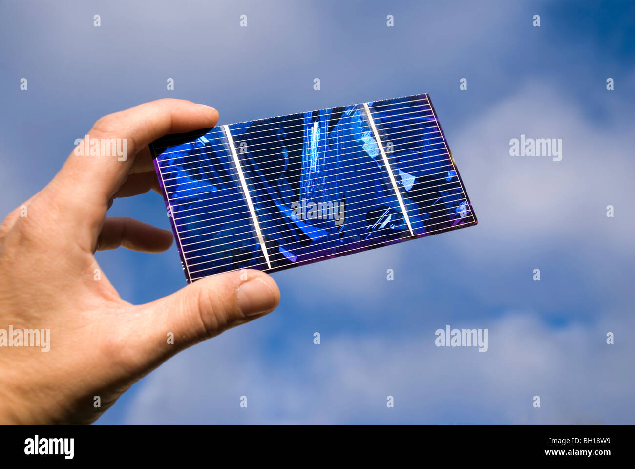 solar cell in a hand Stock Photo - Alamy