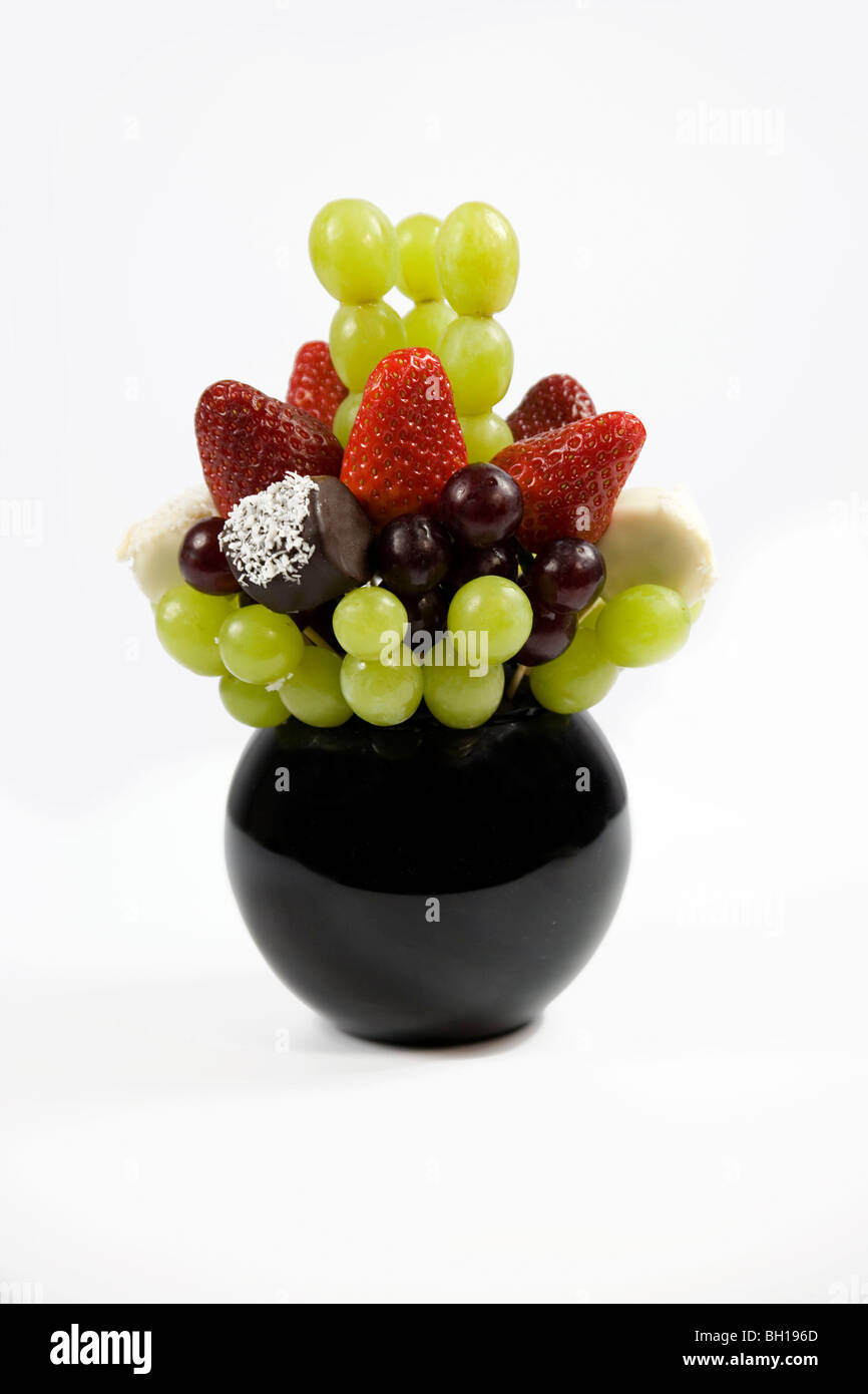 a fresh fruit table arrangement of fruit in a vase for a table ...