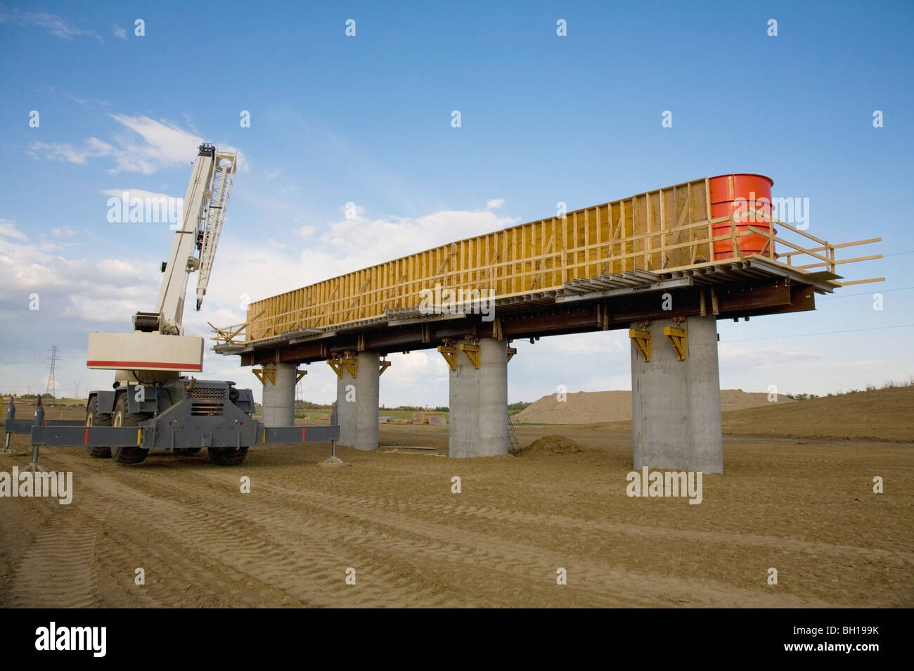 Heavy construction equipment and pilings for bridge Stock Photo - Alamy