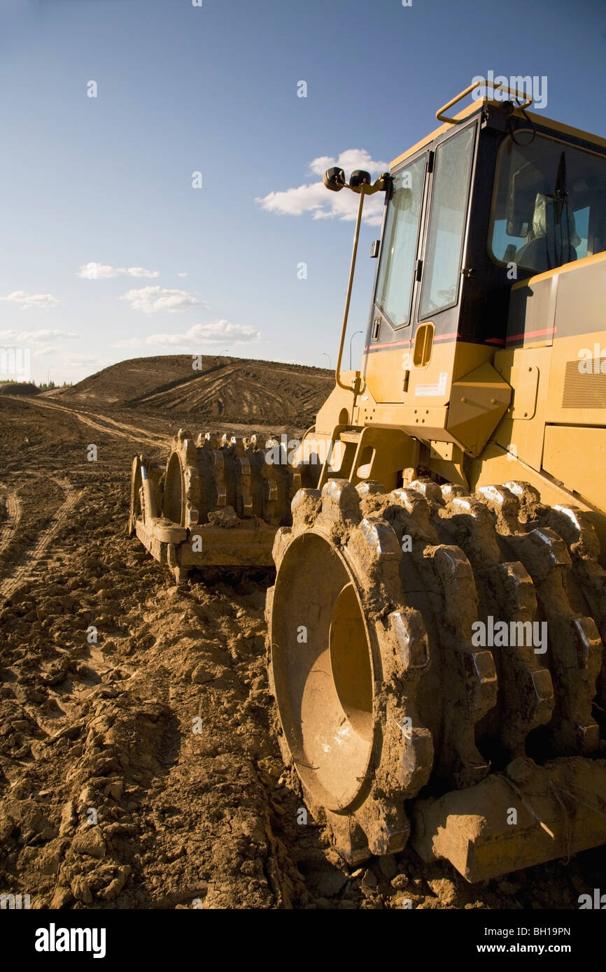 Tractor on construction site Stock Photo - Alamy