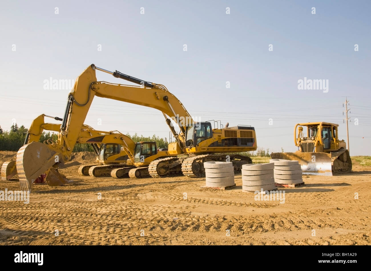 Excavators on construction site Stock Photo - Alamy