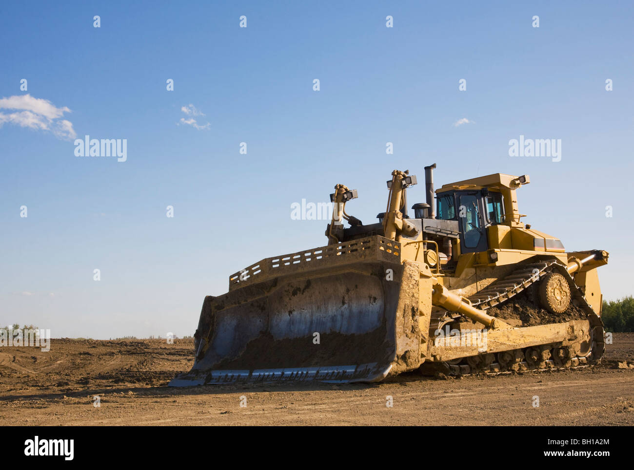 Tractor on construction site Stock Photo - Alamy