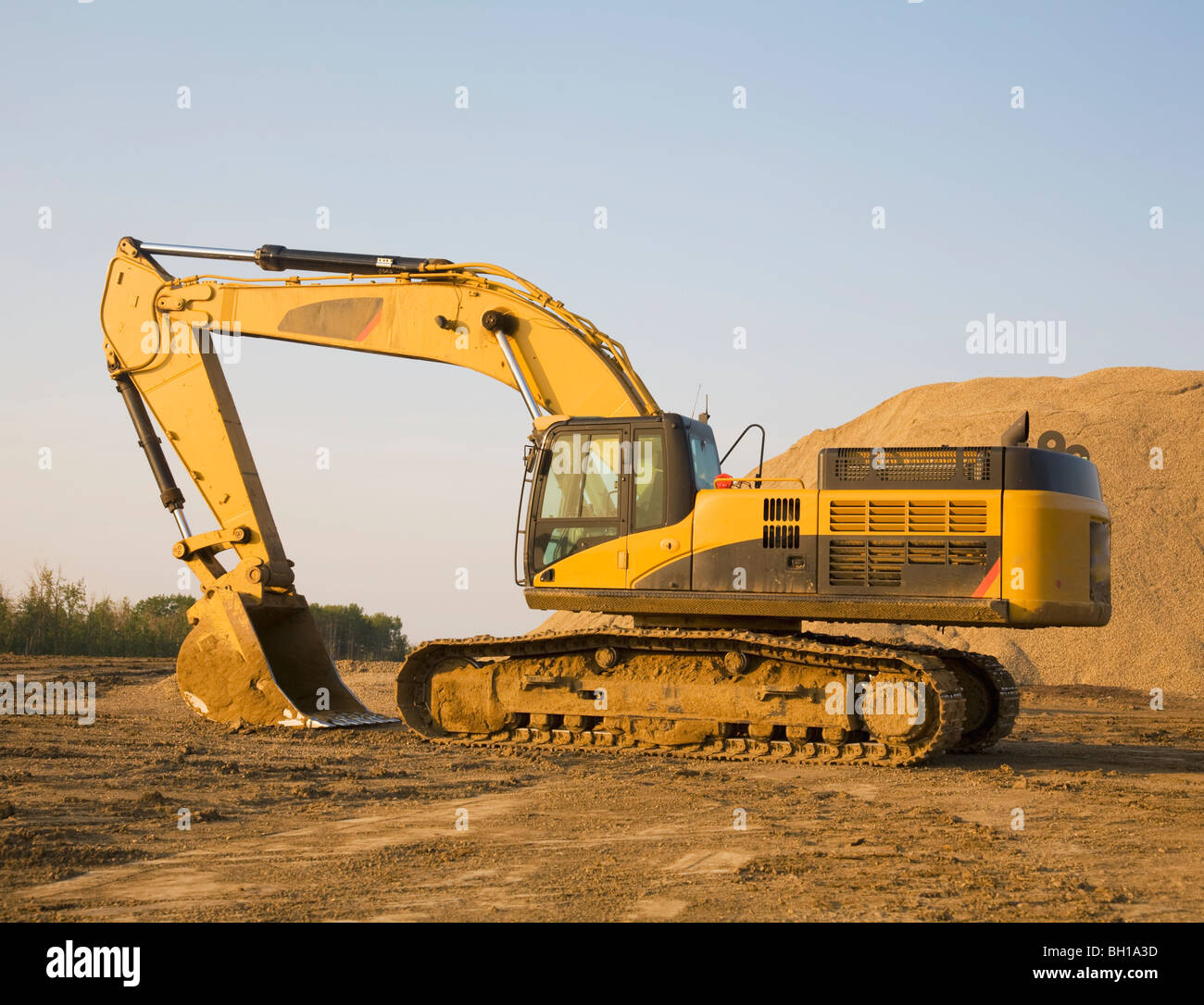 Excavator on construction site Stock Photo - Alamy