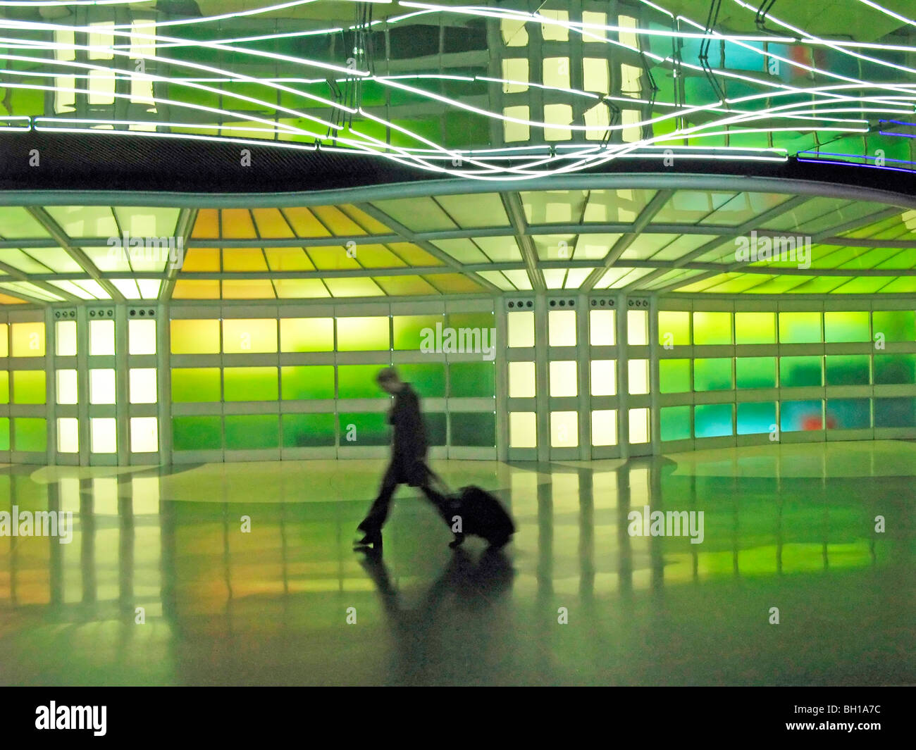 Business woman rushing through airport Stock Photo - Alamy