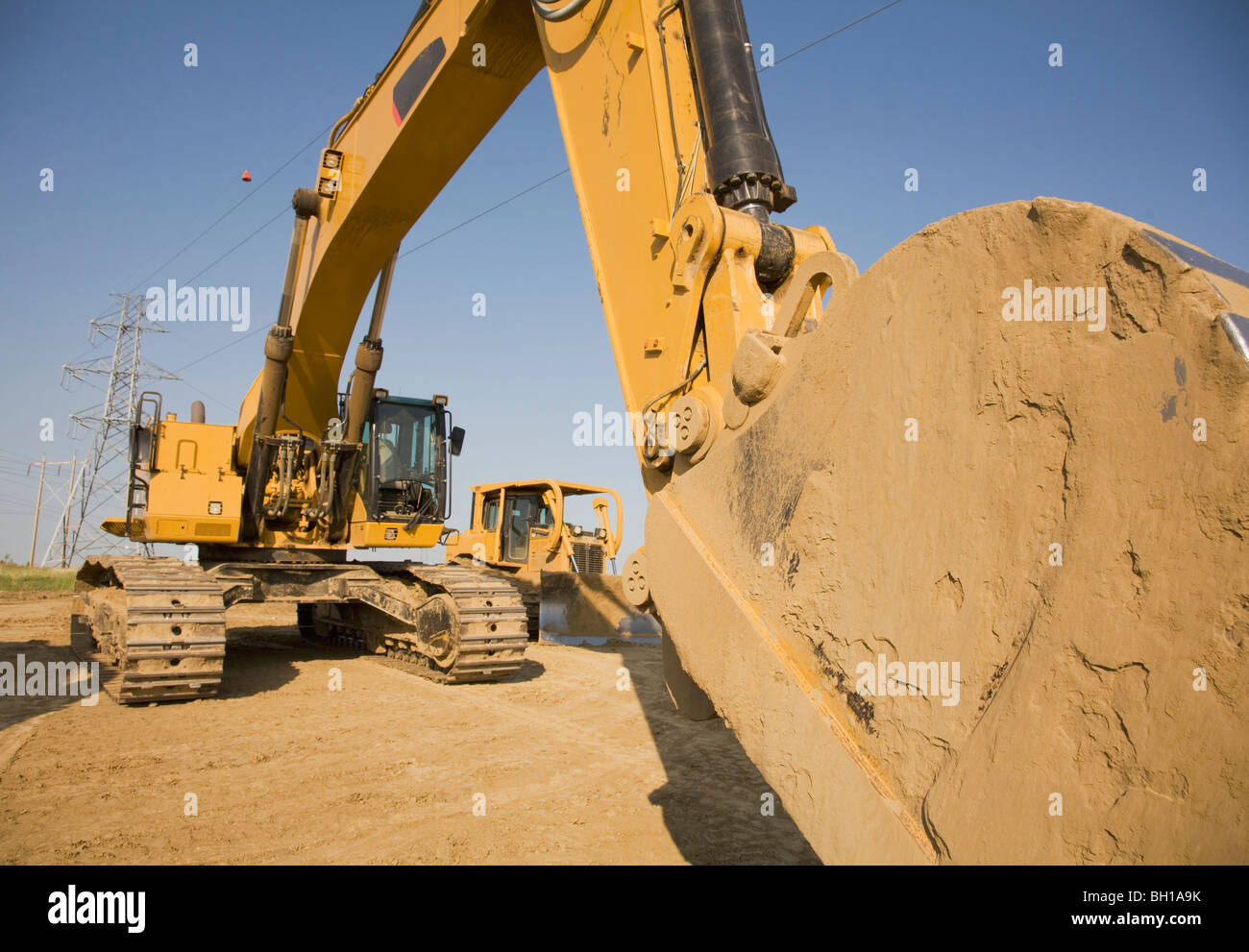 Excavator on construction site Stock Photo - Alamy