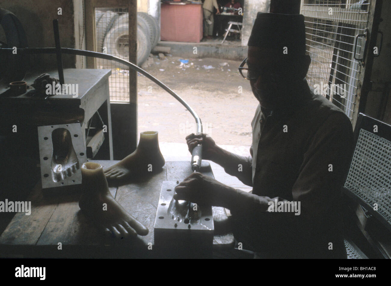 India. Technician in a workshop making artificial 'Jaipur Limb ...