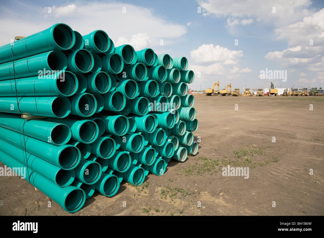 Stack of water pipes for new construction site Stock Photo - Alamy
