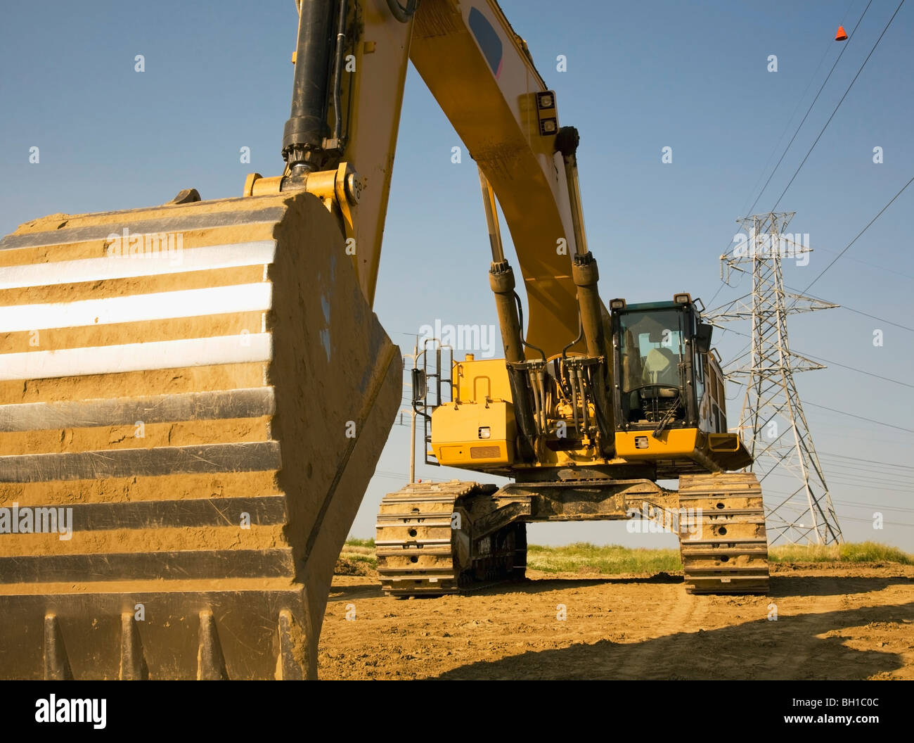 Excavator on construction site Stock Photo - Alamy