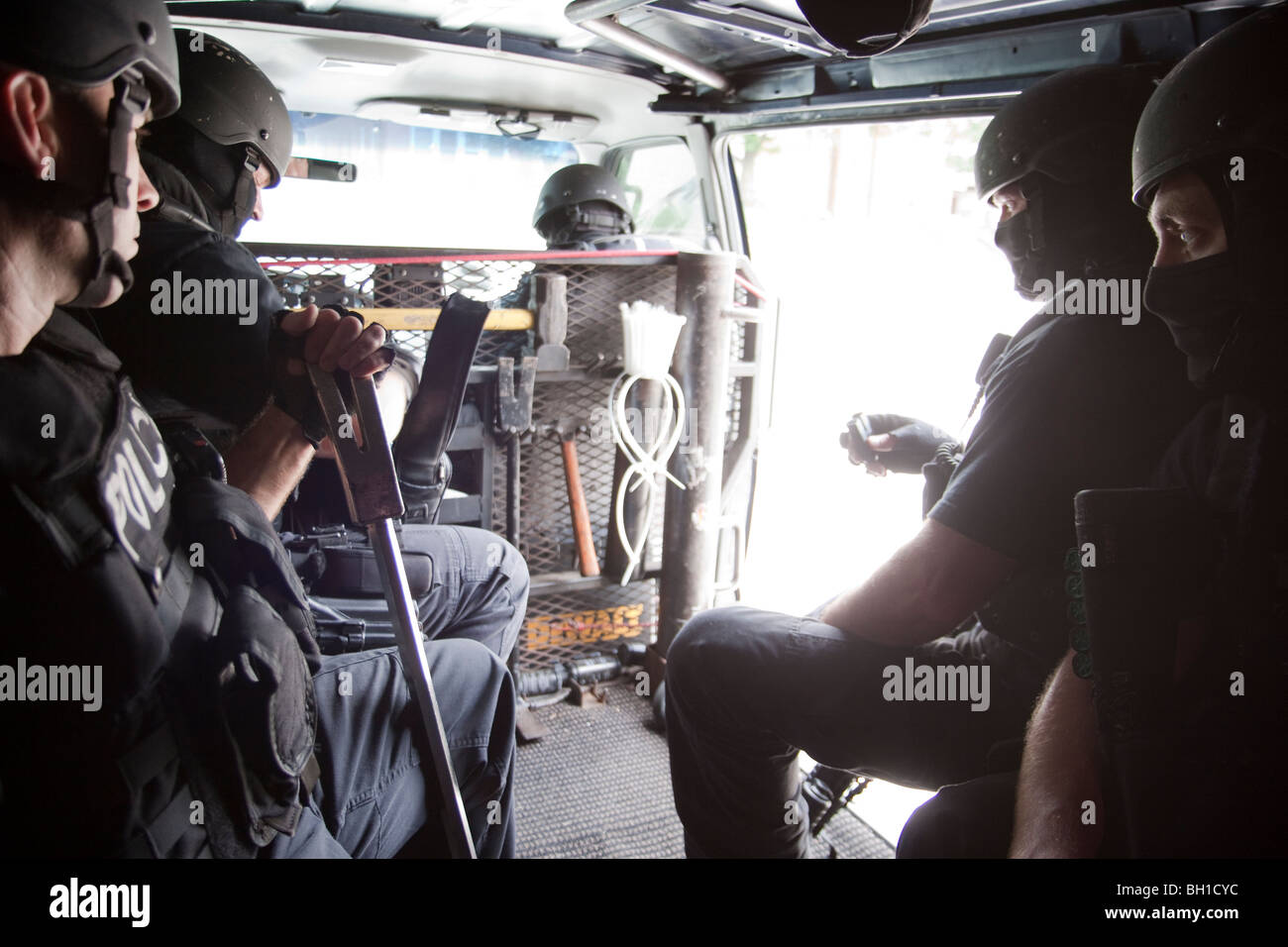 Police officers from tactical squad getting ready to serve high-risk ...