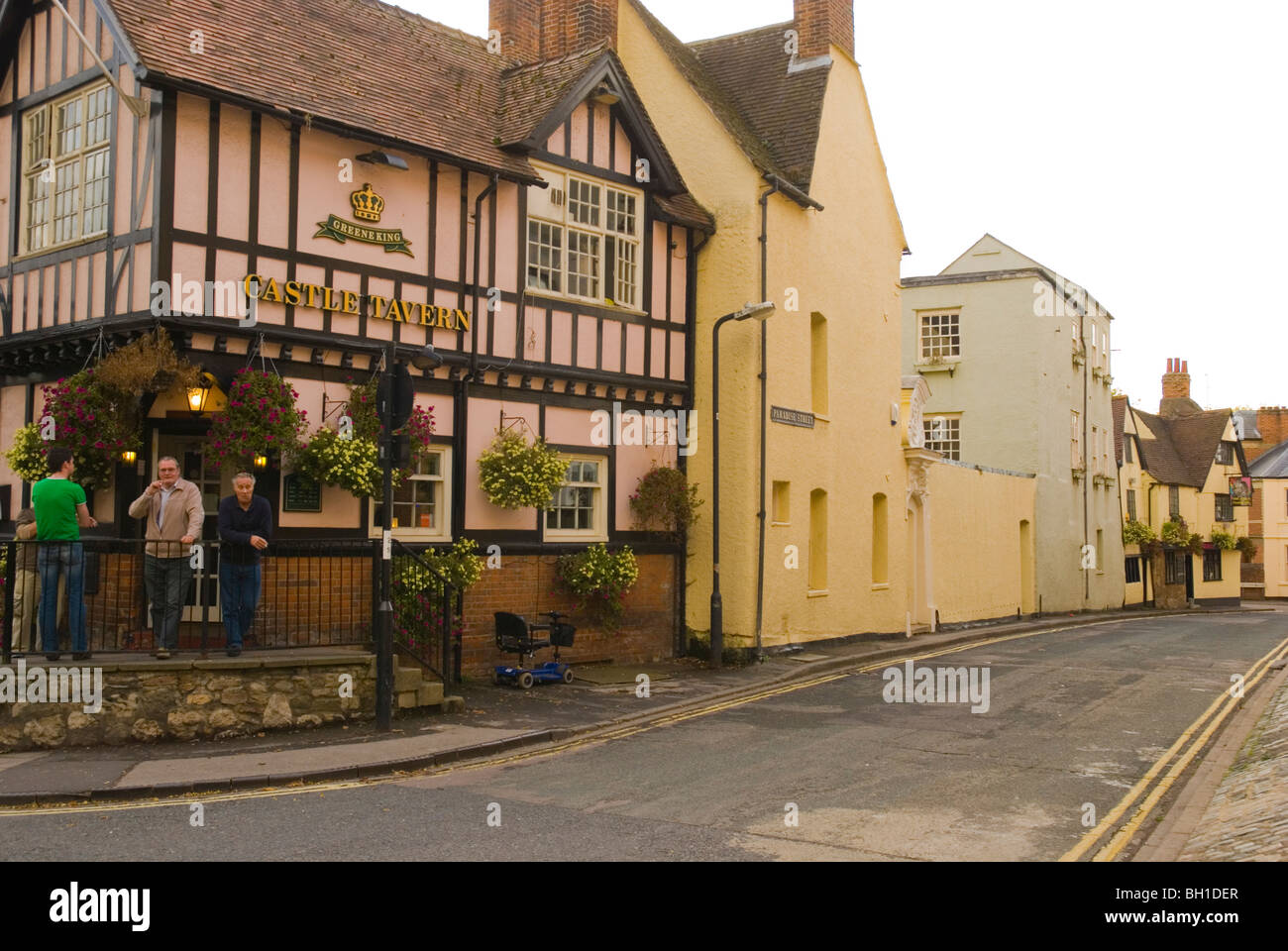 People outside a pub next to the castle in Oxford England UK Europe ...