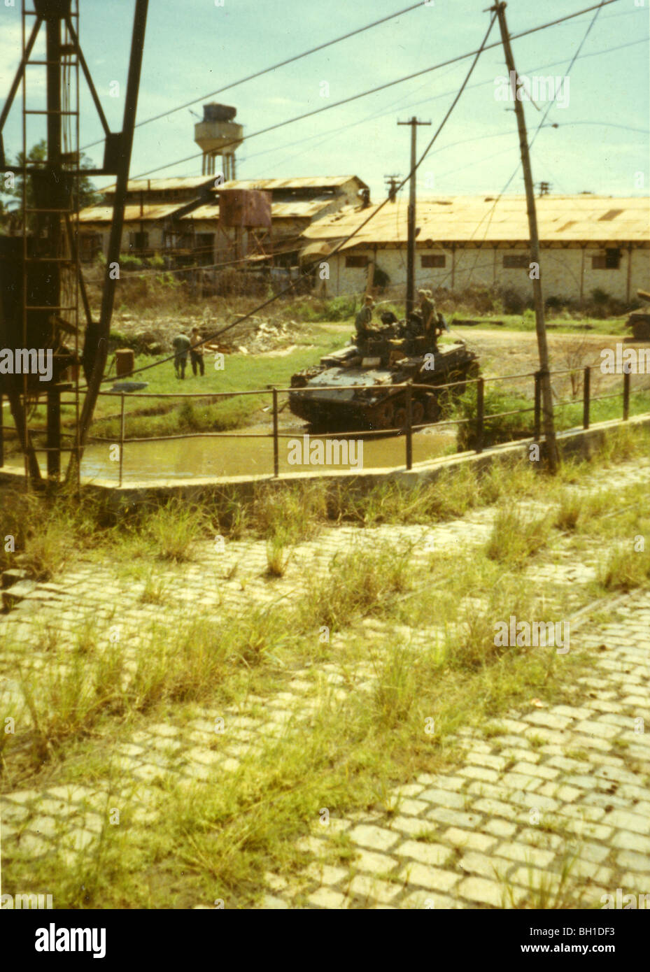 Tank rolls through water. Elements of the 1st Infantry Division operate ...