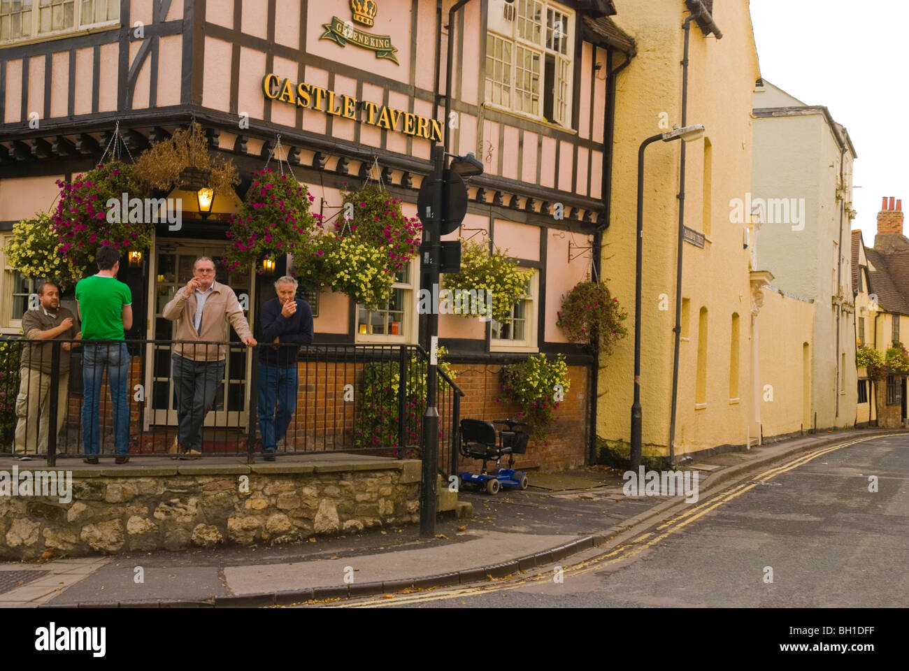 People outside a pub next to the castle in Oxford England UK Europe ...